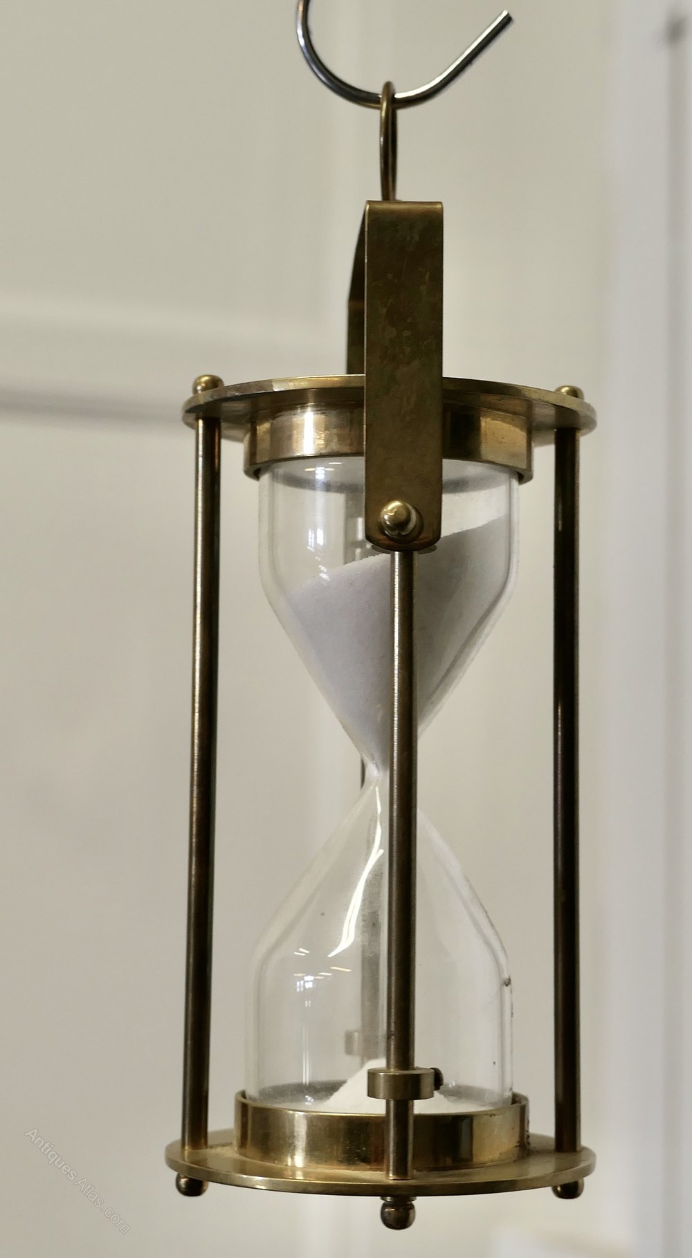 Antiques Atlas - A Vintage Brass 5 Minute Hanging Egg Timer.